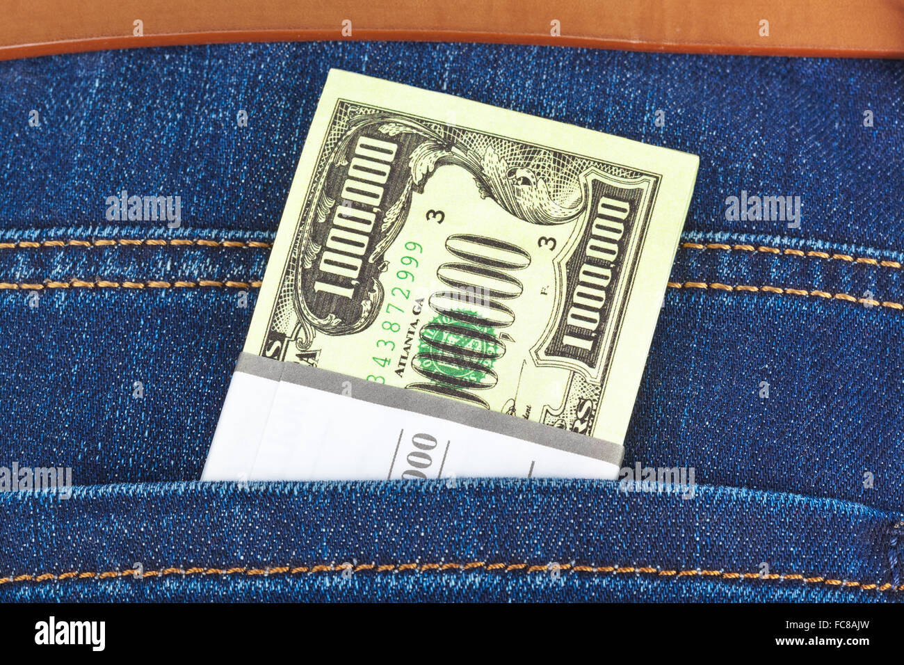 Money in jeans pocket Stock Photo - Alamy