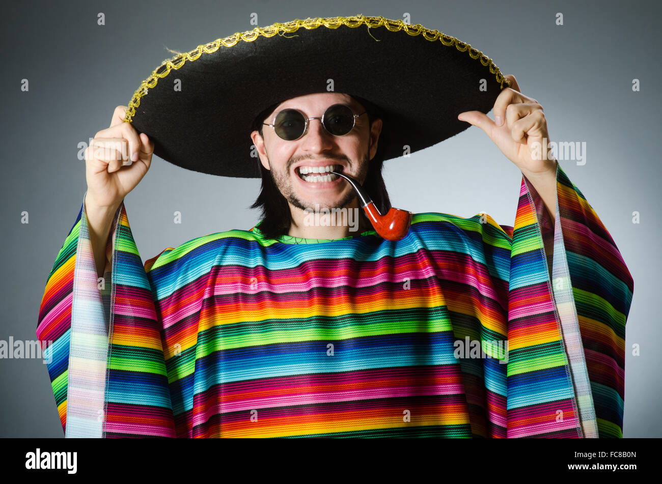 Mexican smoking pipe wearing sombrero Stock Photo - Alamy