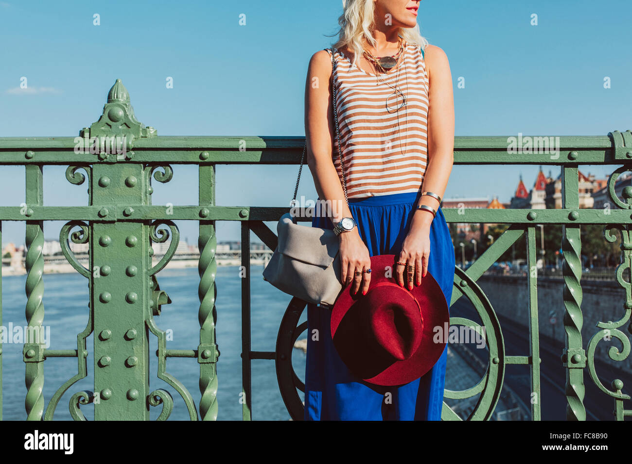 Caucasian woman standing on bridge Stock Photo - Alamy