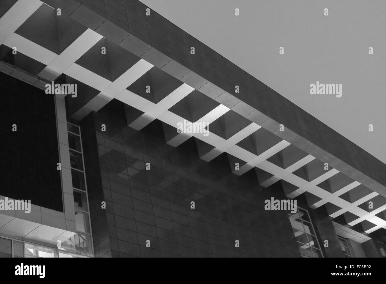 Diagonal abstract of a modern building roof shot at night with square ...