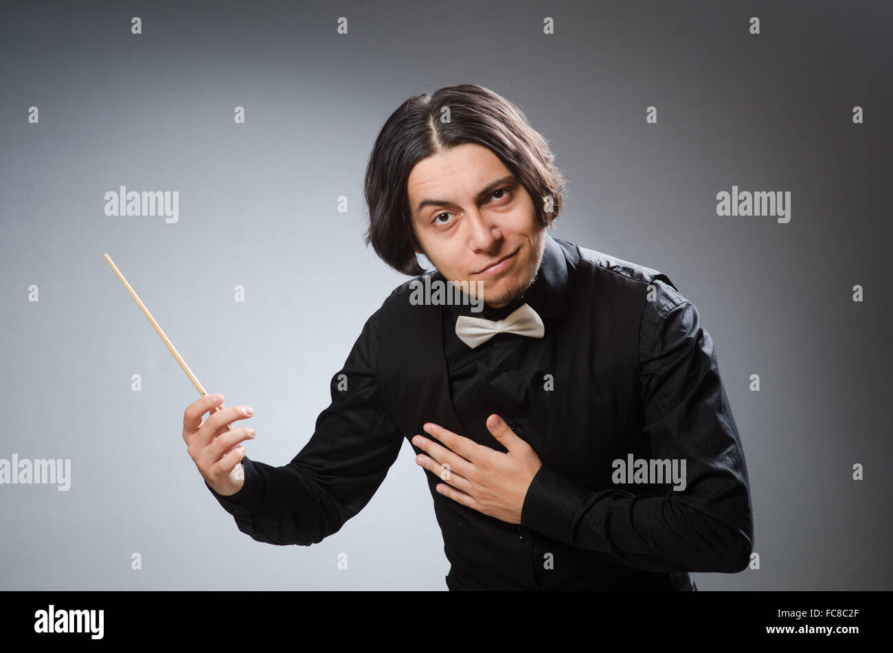 Funny conductor in musical concept Stock Photo - Alamy