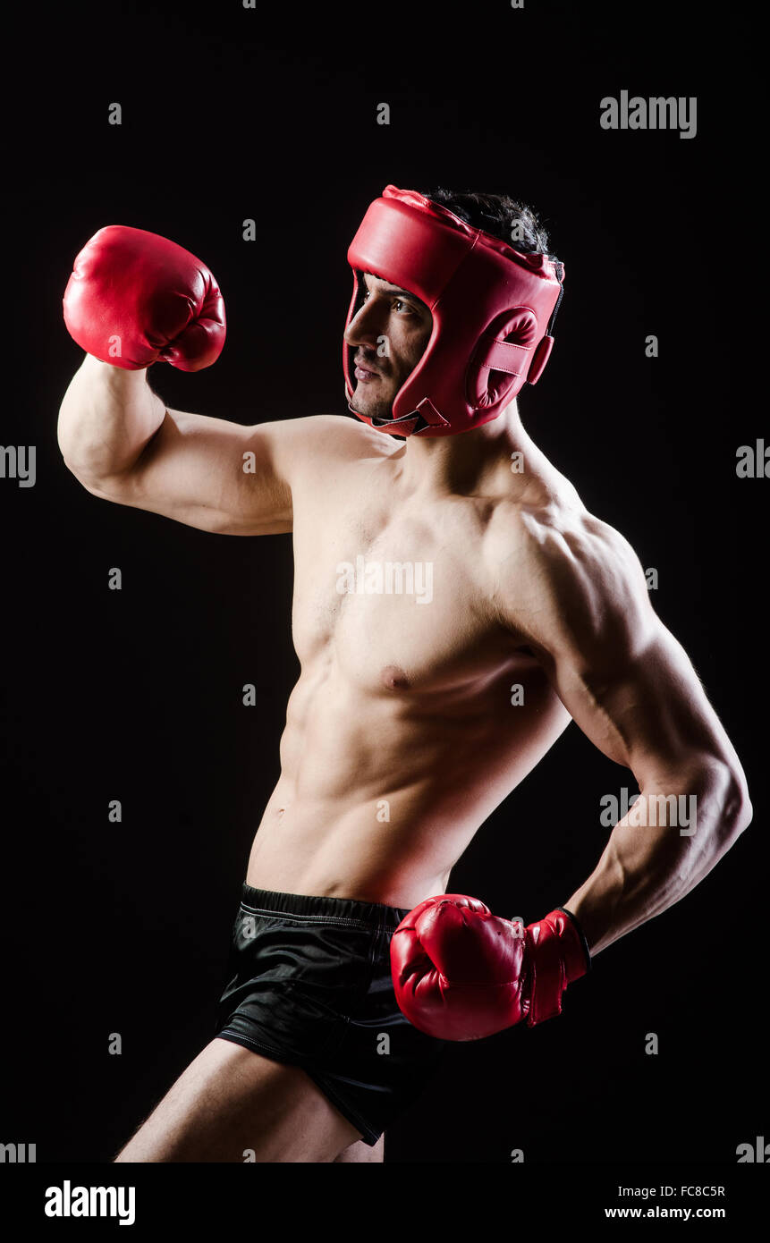 Muscular man in boxing concept Stock Photo - Alamy