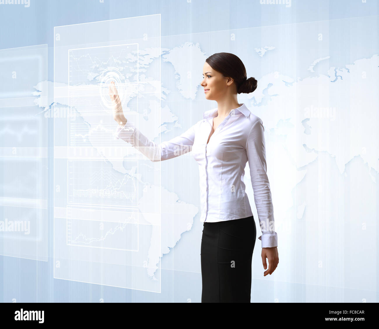 Young woman in business wear with touchscreen technology background ...
