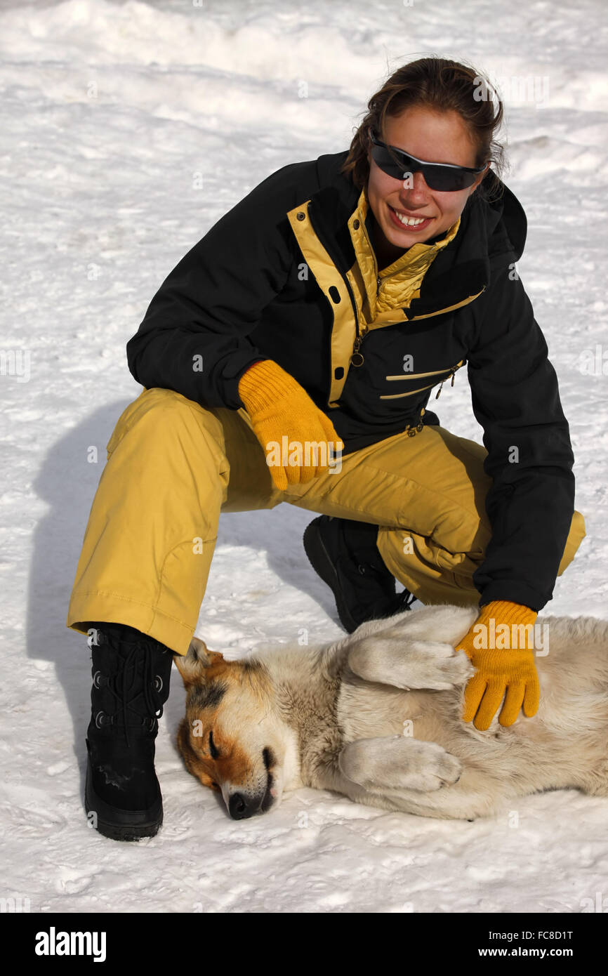 Woman with a stray dog Stock Photo - Alamy