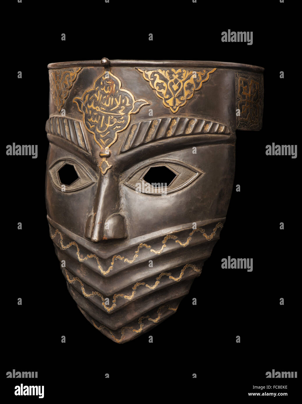 Metal mask isolated on black Stock Photo - Alamy