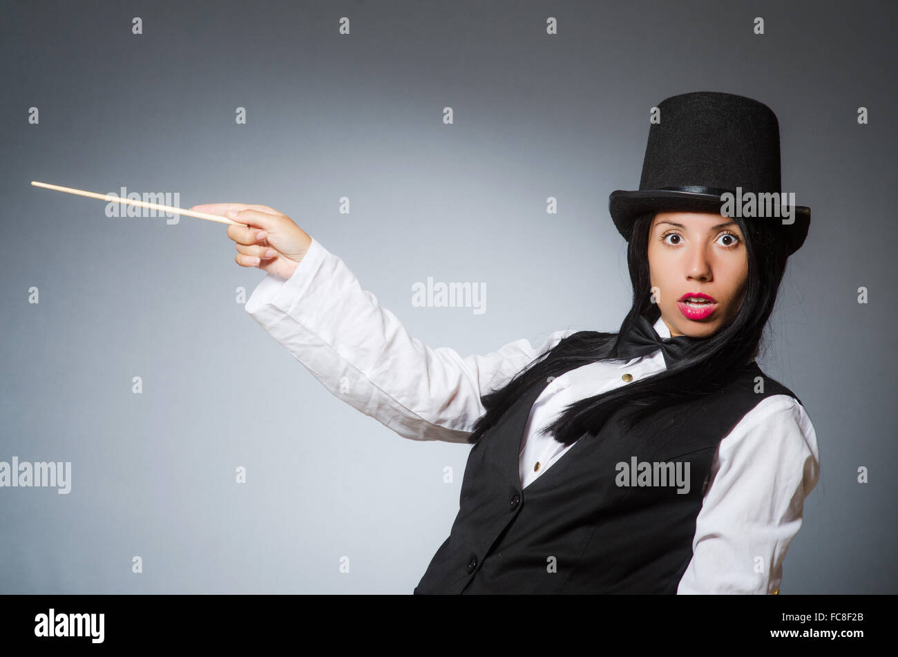 Woman magician in funny concept Stock Photo - Alamy