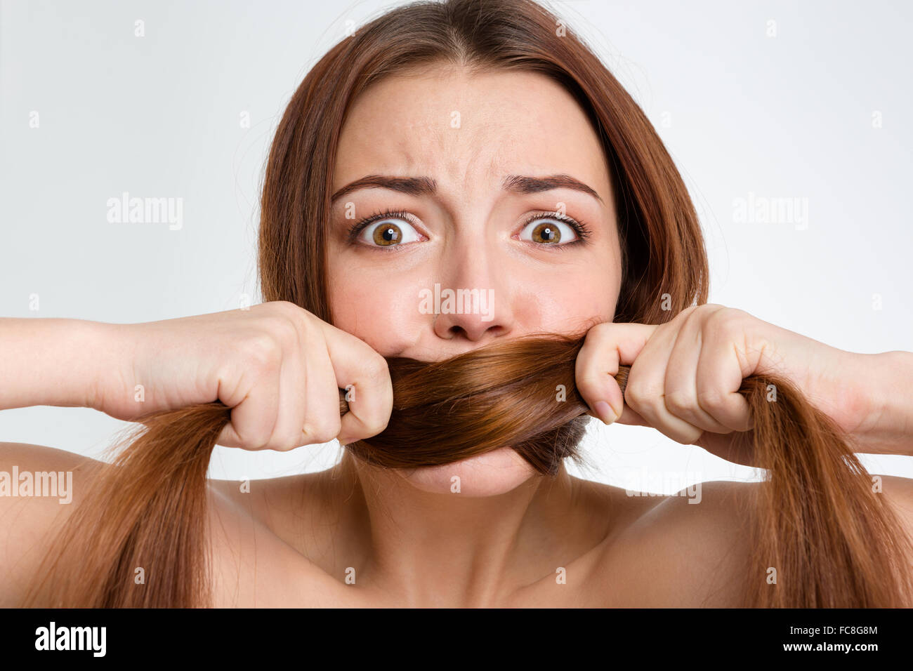Closeup portrait of scared frightened young woman covered her mouth ...