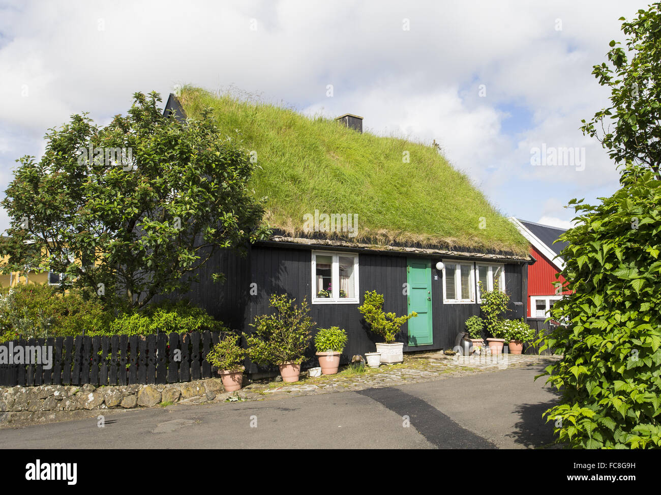 House with grass roof Stock Photo - Alamy