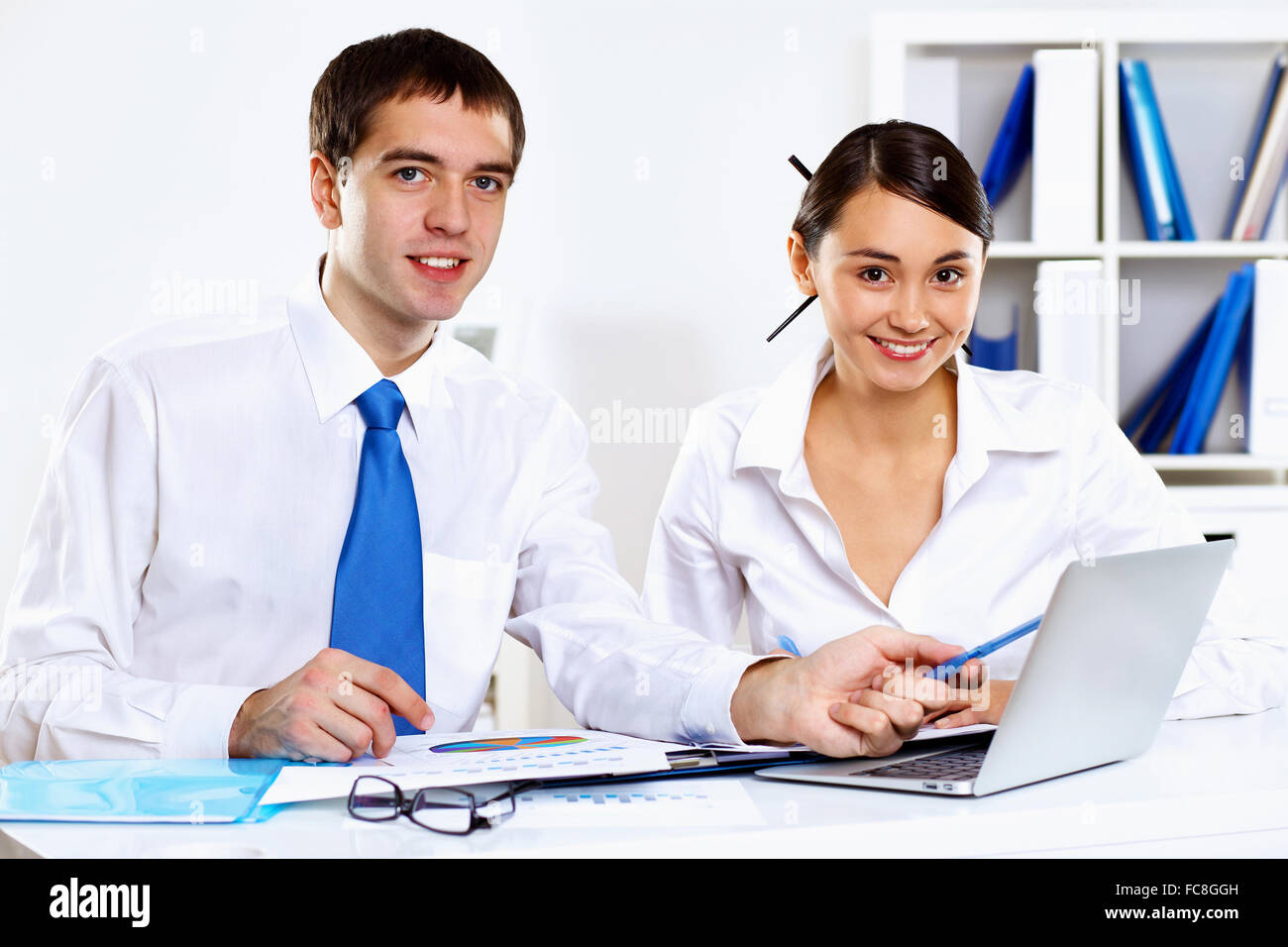 Two young business collegue working together in office Stock Photo - Alamy