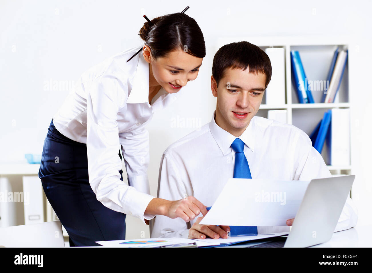Two young business collegue working together in office Stock Photo - Alamy