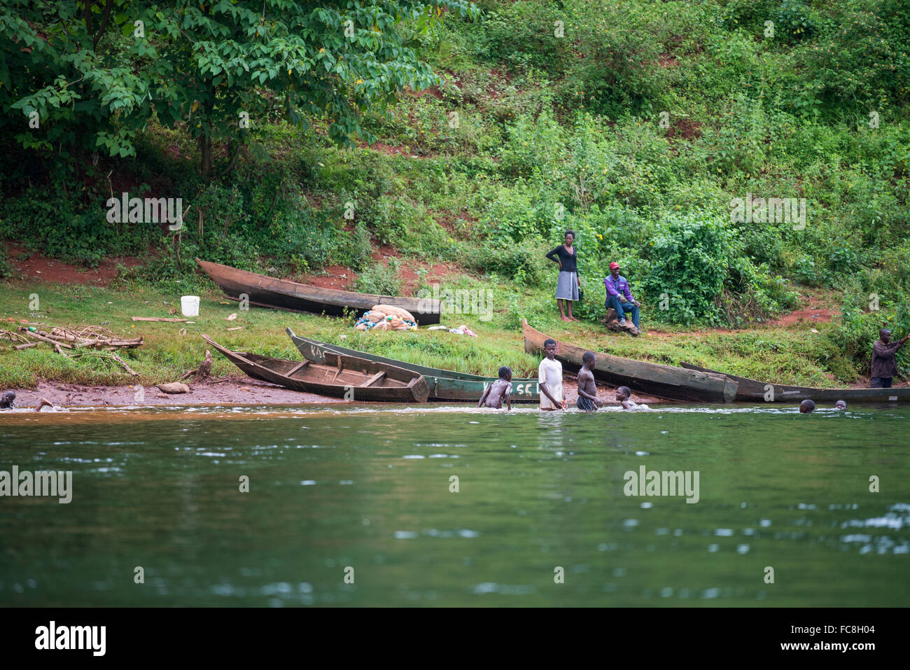 Local villagers washing and drying clothes by the river in Jinja ...