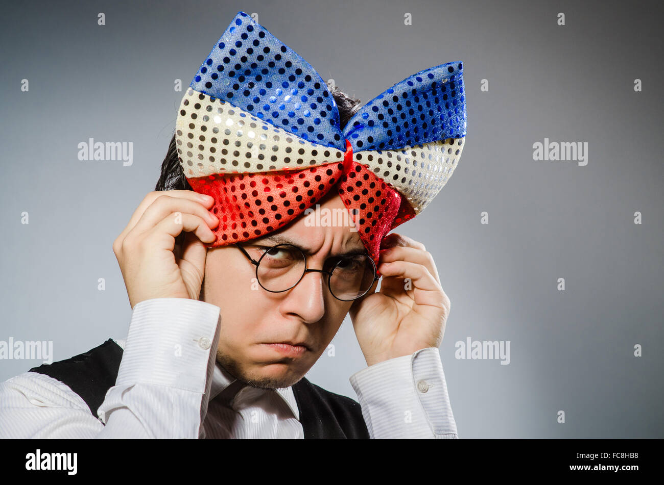 Funny man with giant bow tie Stock Photo - Alamy