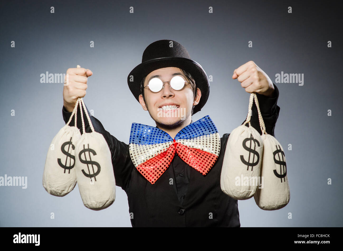 Funny man with money dollar sacks Stock Photo - Alamy