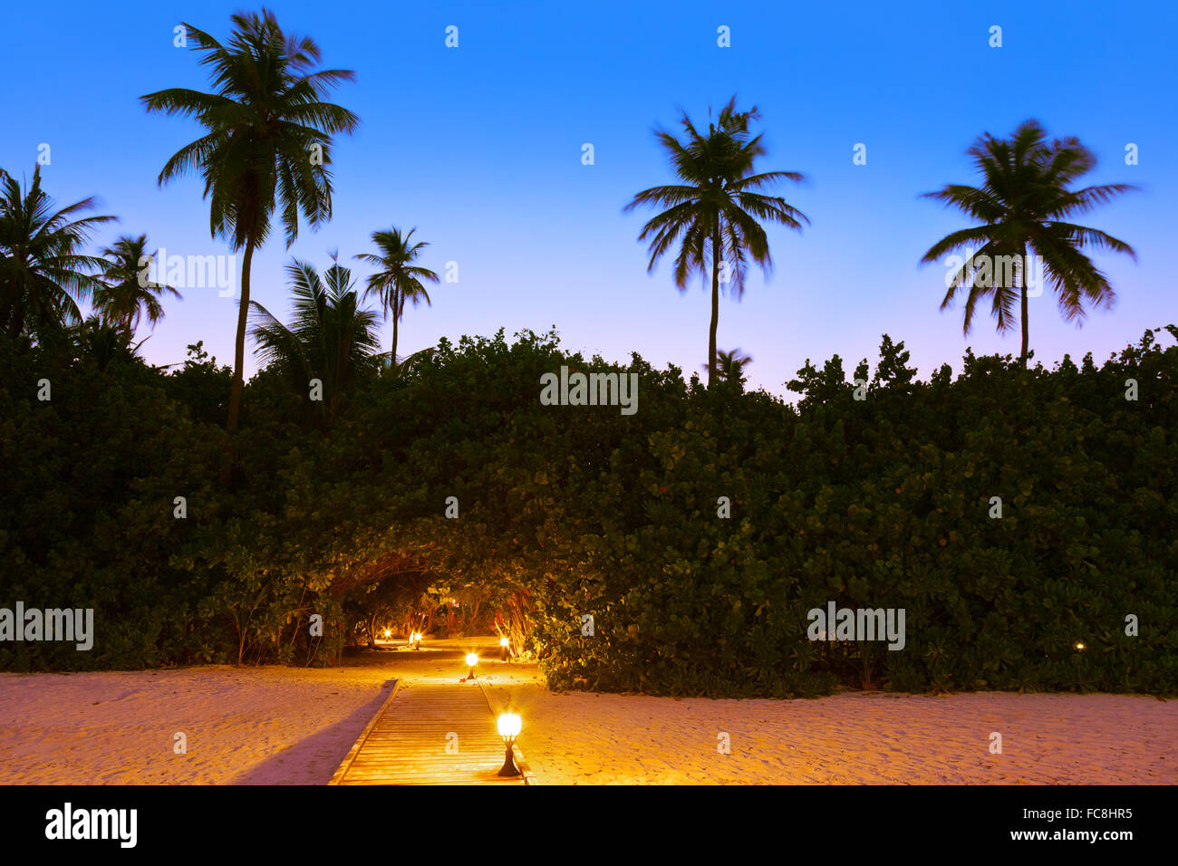 Jetty beach at sunset - Maldives Stock Photo - Alamy