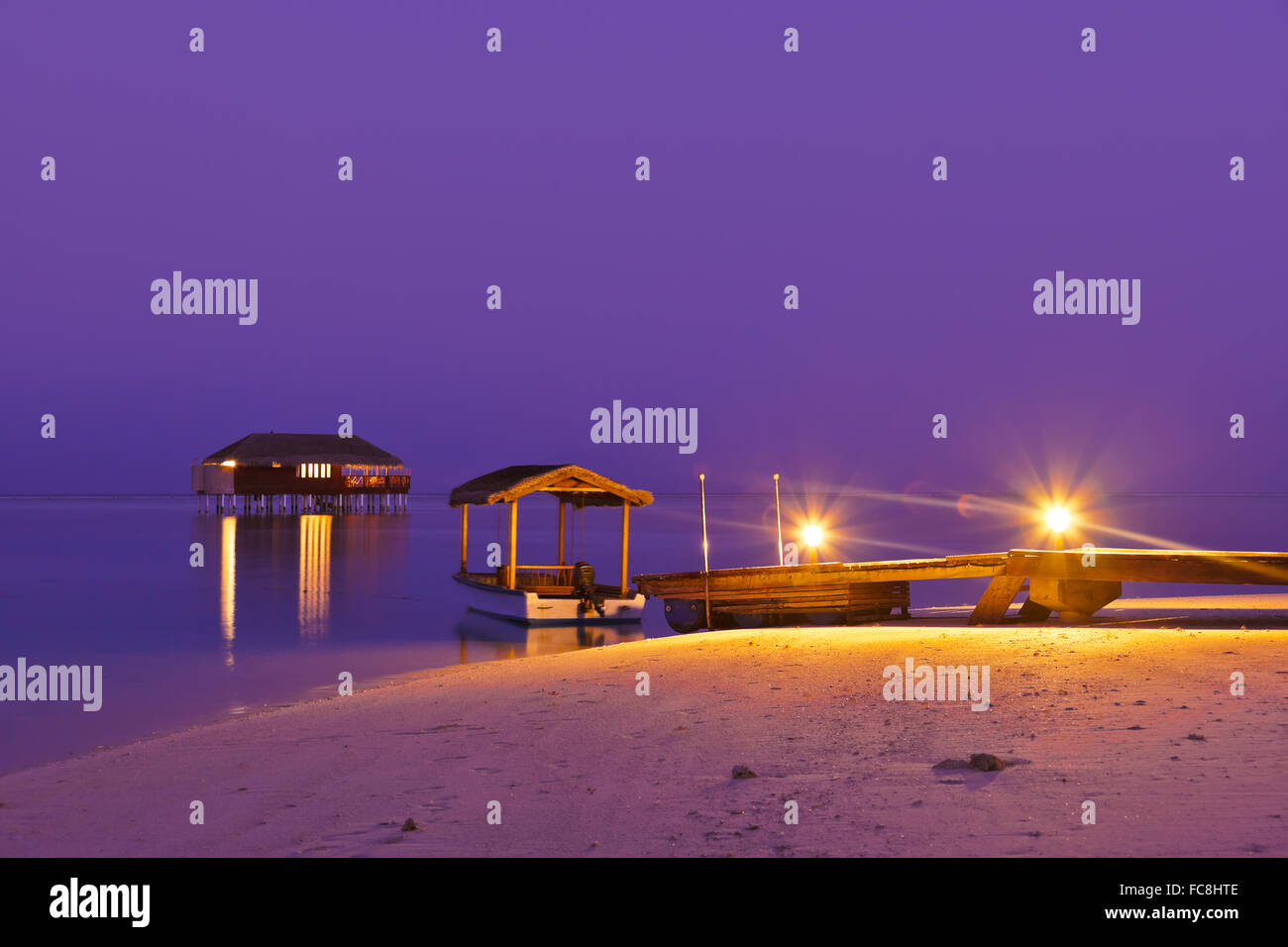 Jetty beach at sunset - Maldives Stock Photo - Alamy