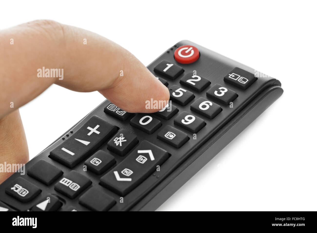 Hand and remote control Stock Photo - Alamy