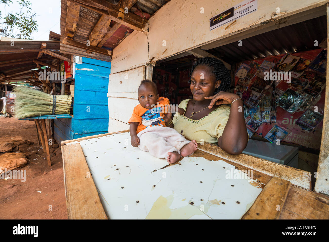 local woman selling food in their shop, Near Jinja, Uganda, Africa ...