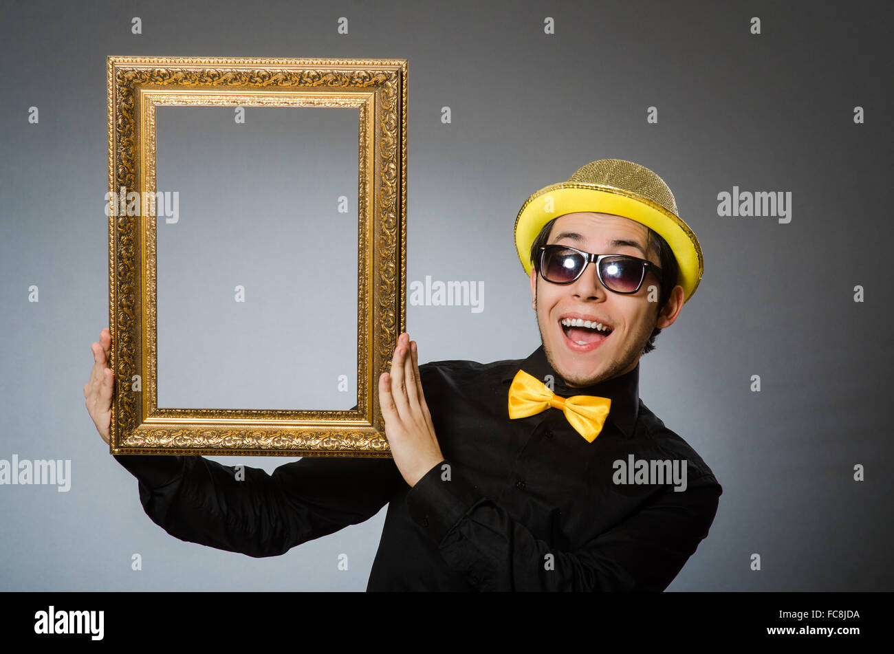 Funny man with picture frame Stock Photo - Alamy