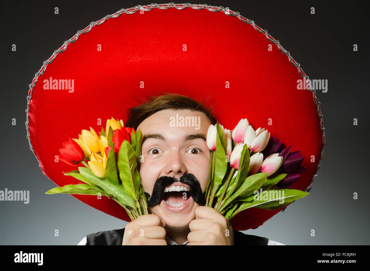 Person wearing sombrero hat in funny concept Stock Photo - Alamy