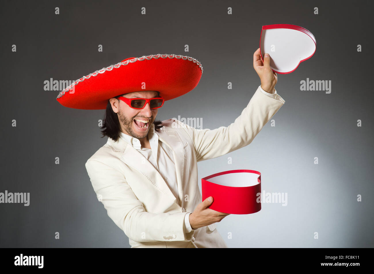 Person wearing sombrero hat in funny concept Stock Photo - Alamy