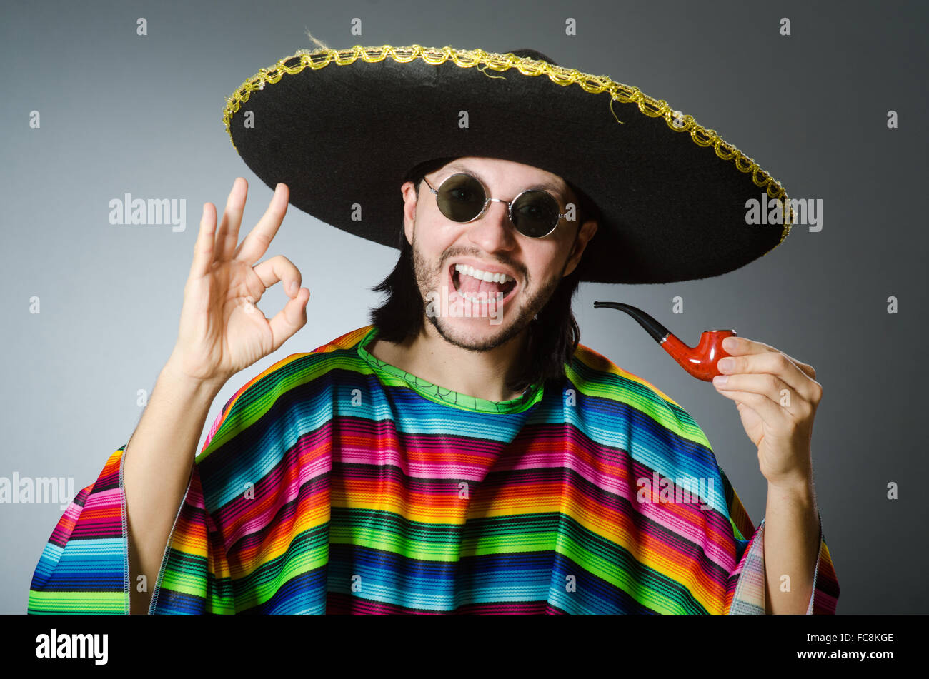 Mexican smoking pipe wearing sombrero Stock Photo - Alamy