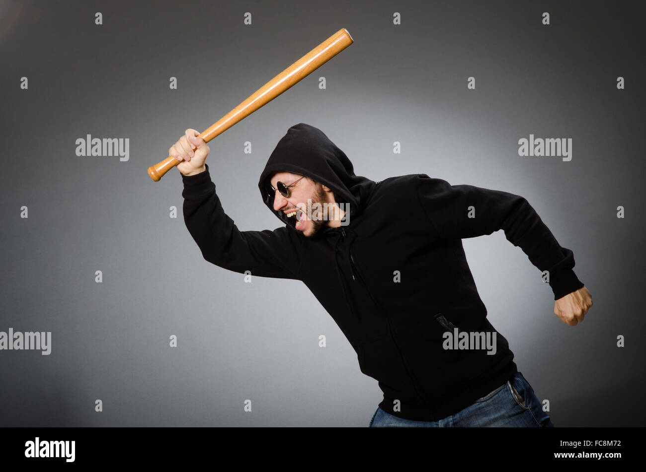 Aggressive man with basebal bat Stock Photo - Alamy