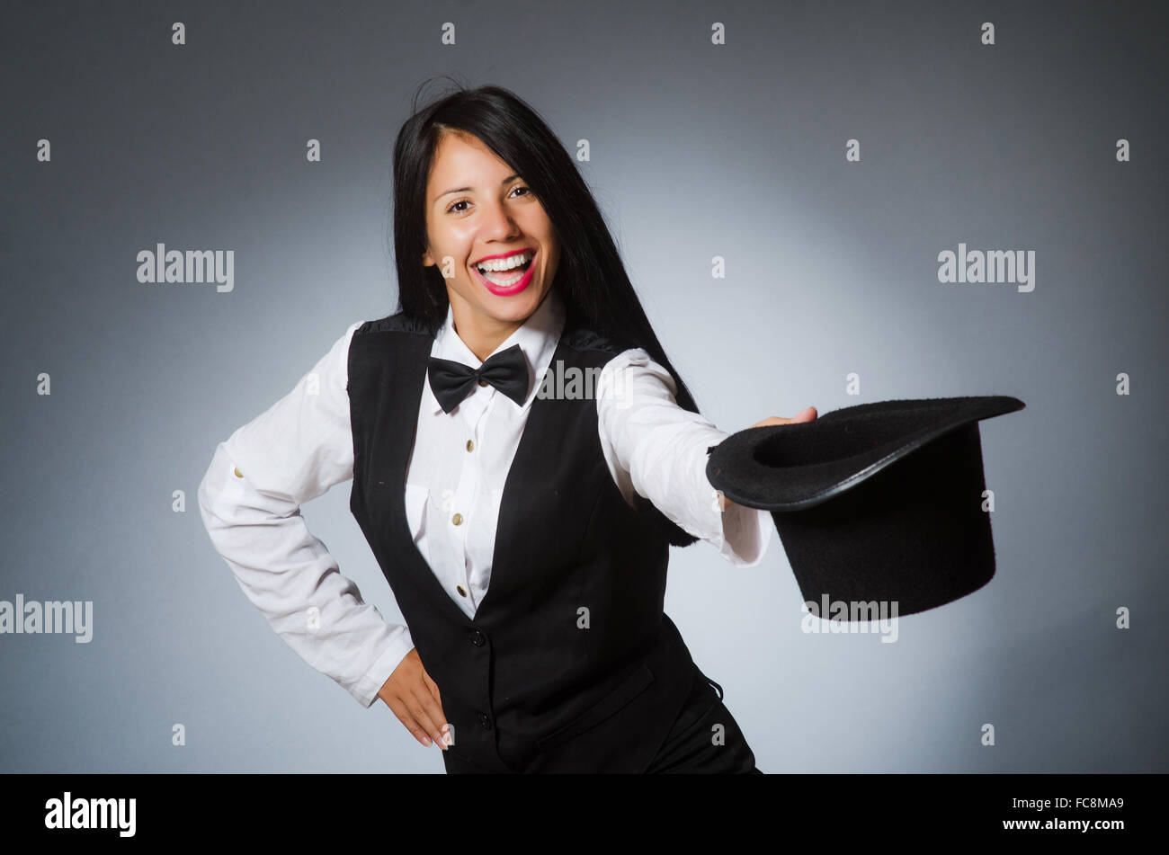 Woman magician in funny concept Stock Photo - Alamy