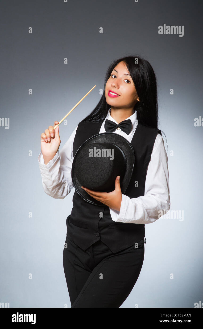 Woman magician in funny concept Stock Photo - Alamy