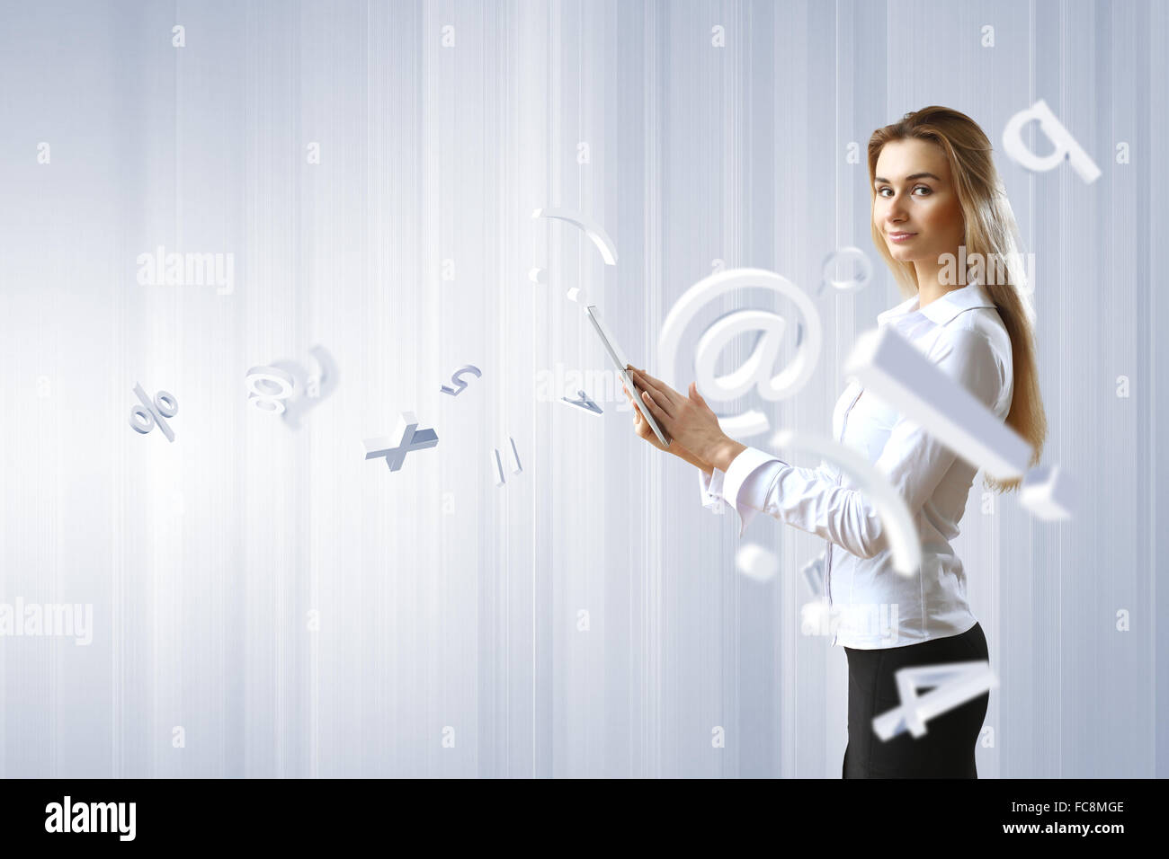 Young woman in business wear with touchscreen technology background ...