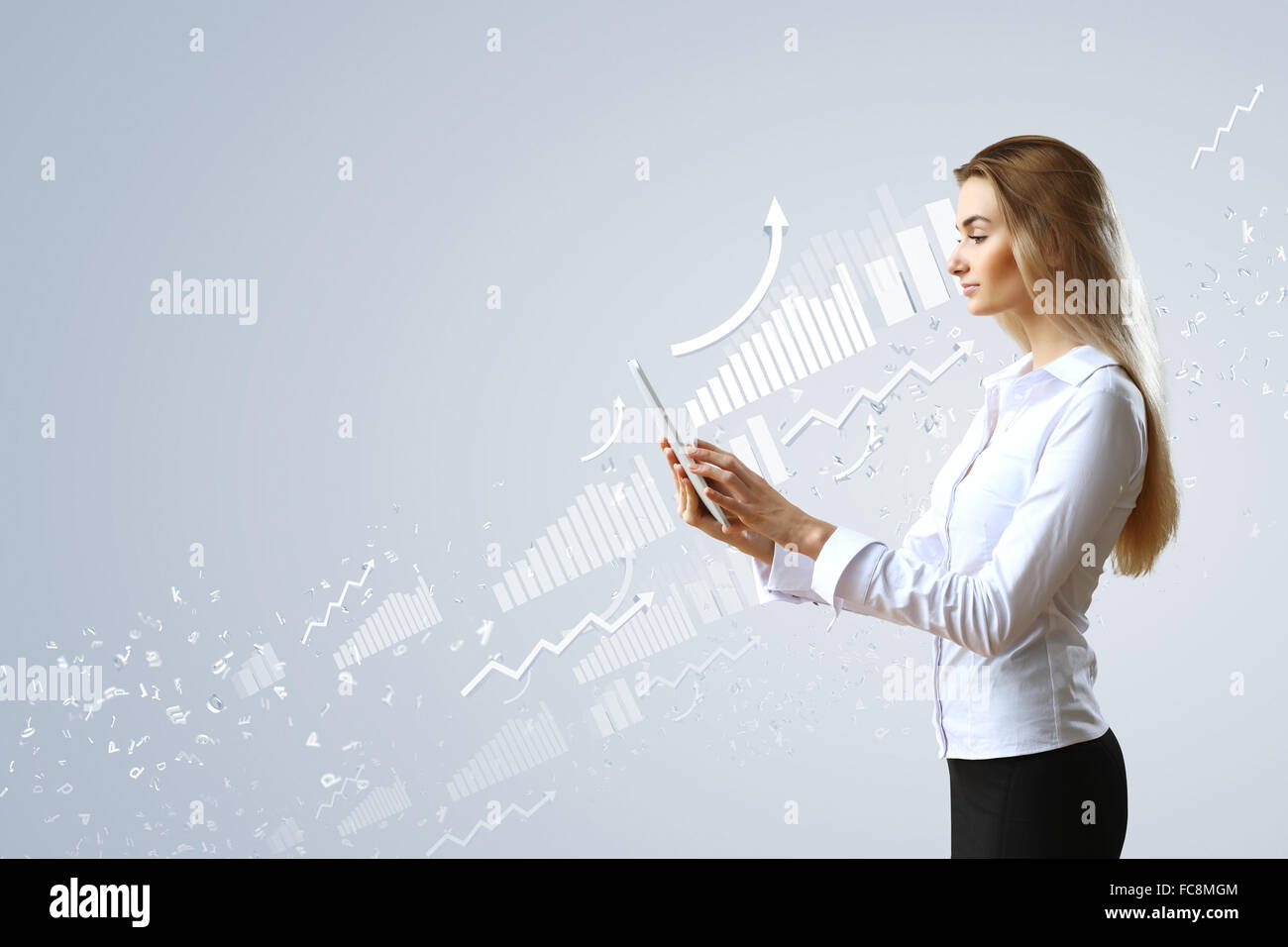 Young woman in business wear with touchscreen technology background ...