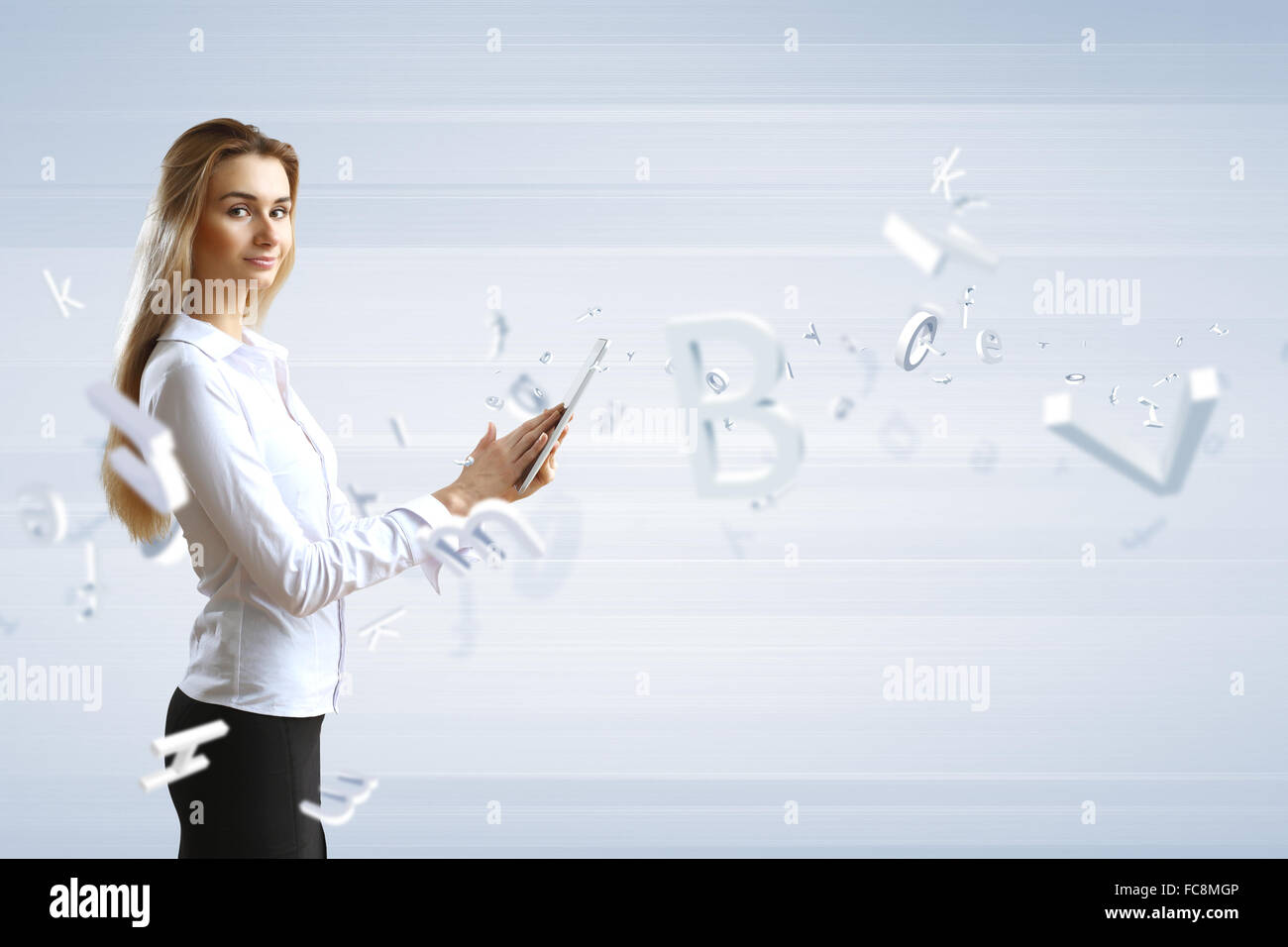 Young woman in business wear with touchscreen technology background ...