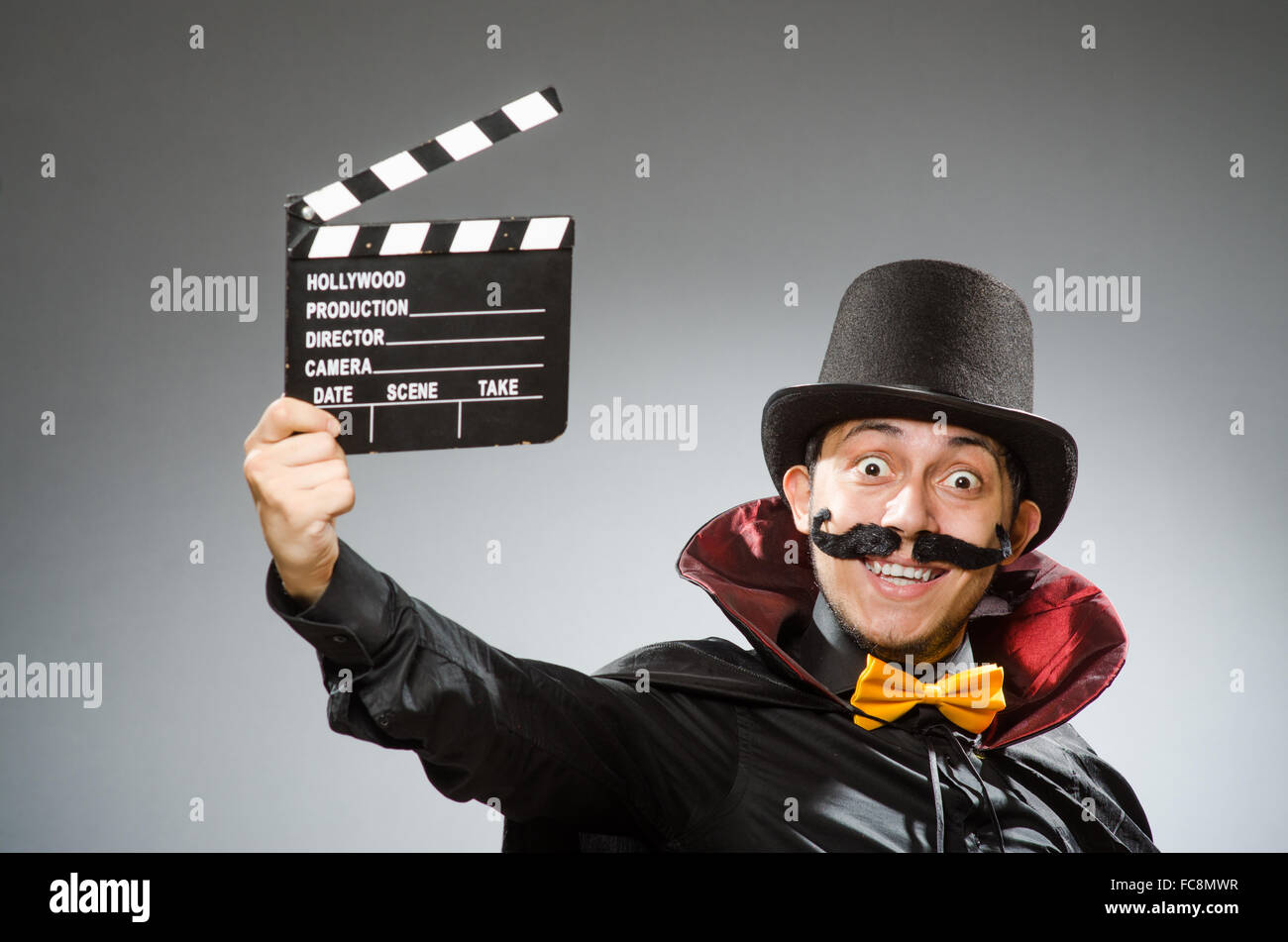 Funny man with movie clapboard Stock Photo - Alamy