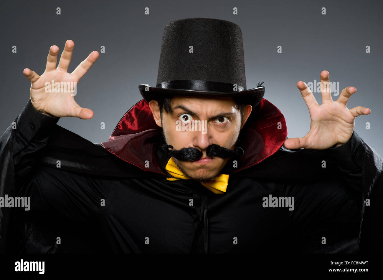 Funny magician man wearing tophat Stock Photo - Alamy