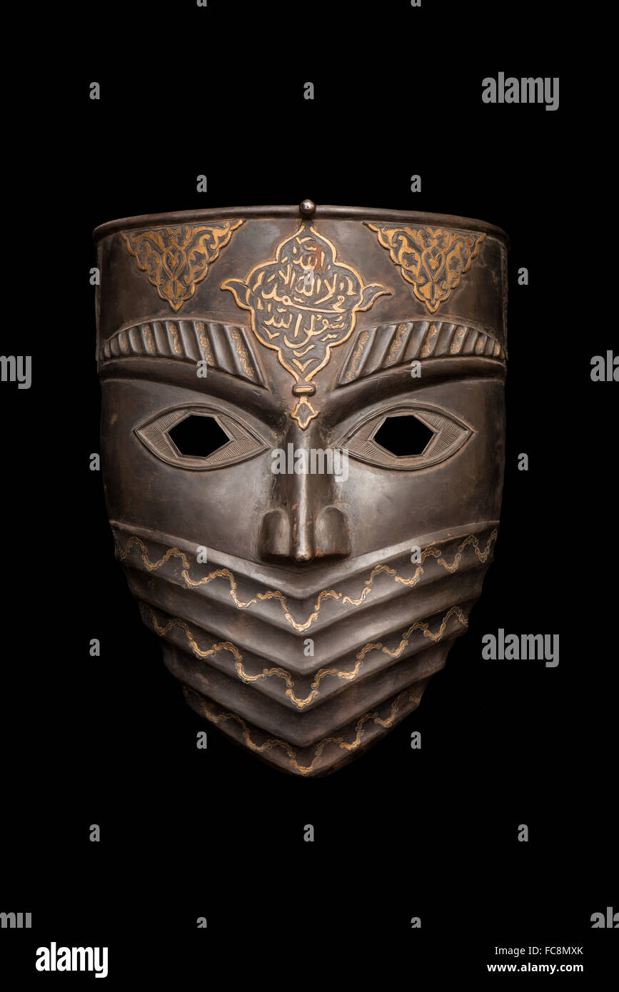 Metal mask isolated on black Stock Photo - Alamy
