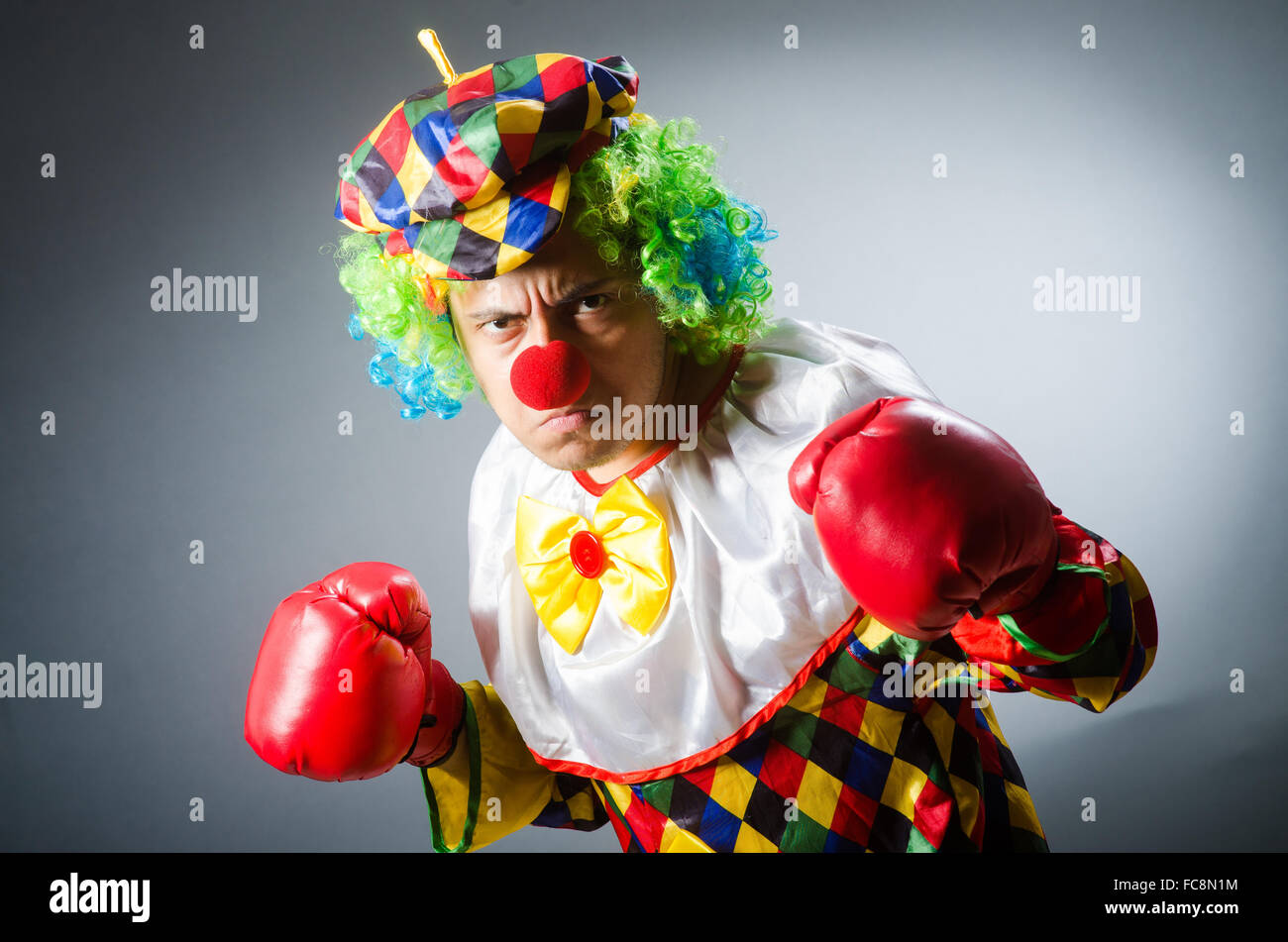 Funny clown in comical concept Stock Photo - Alamy