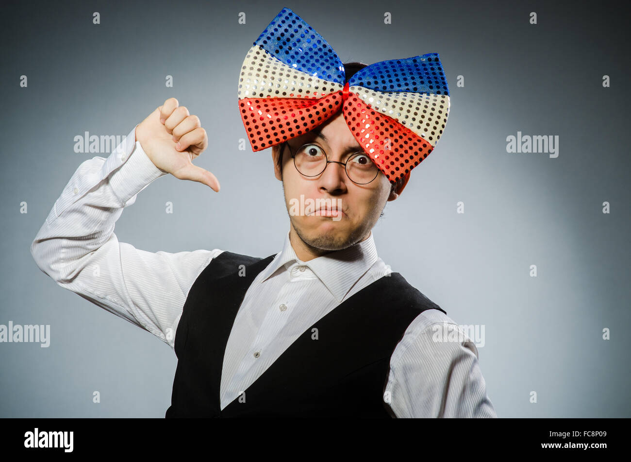 Funny man with giant bow tie Stock Photo - Alamy