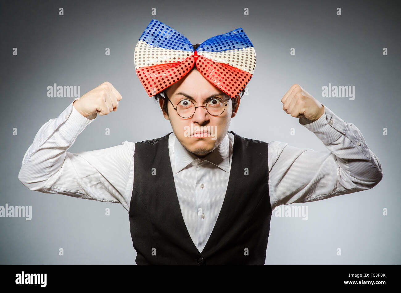 Funny man with giant bow tie Stock Photo - Alamy