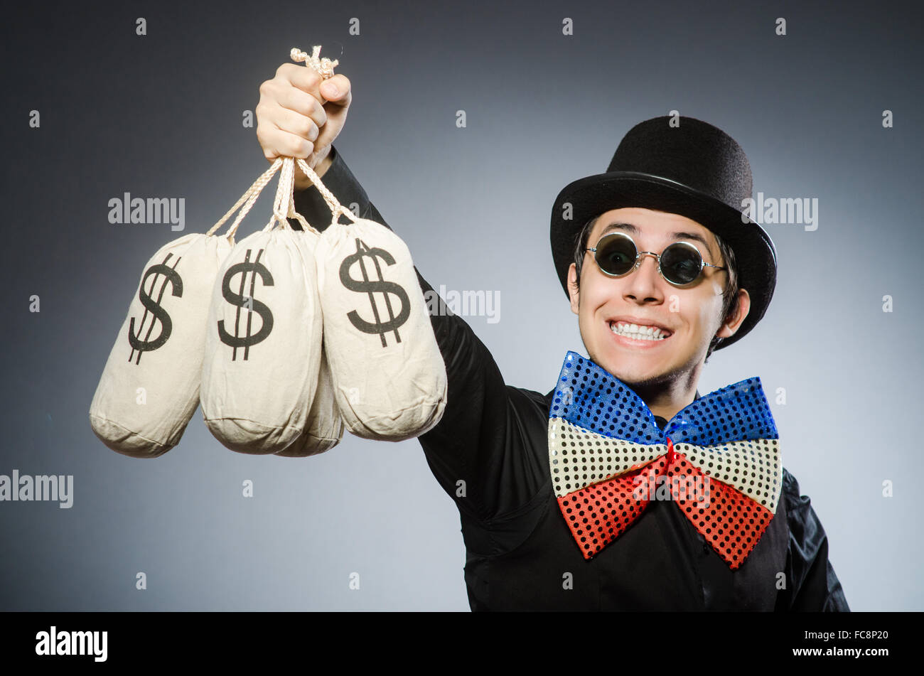 Funny man with money dollar sacks Stock Photo - Alamy