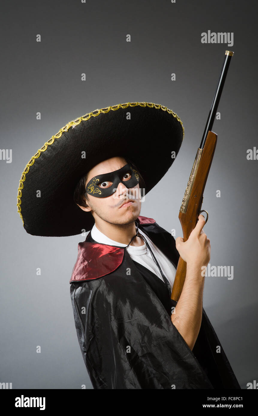 Person wearing sombrero hat in funny concept Stock Photo - Alamy