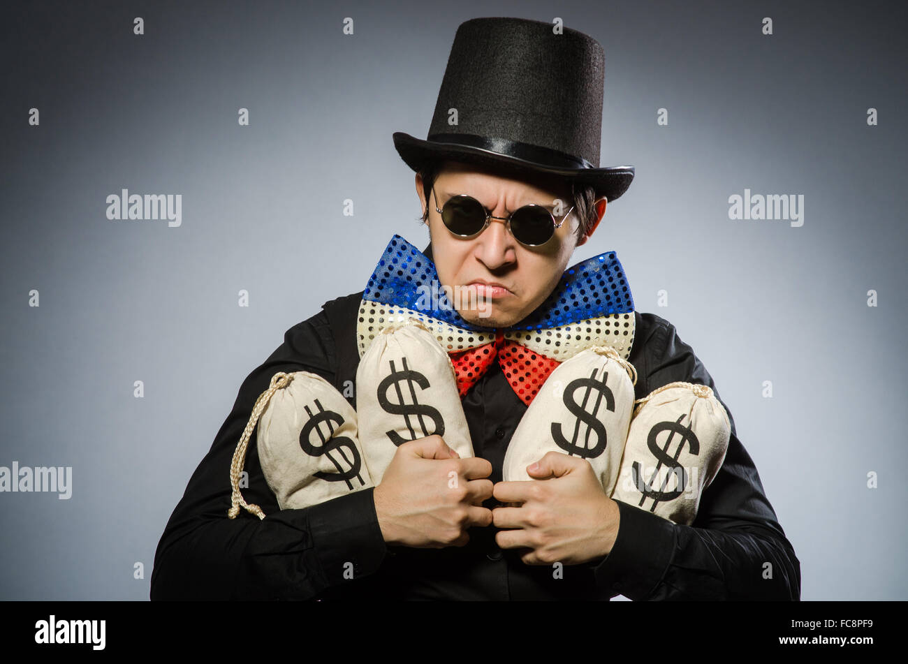 Funny man with money dollar sacks Stock Photo - Alamy