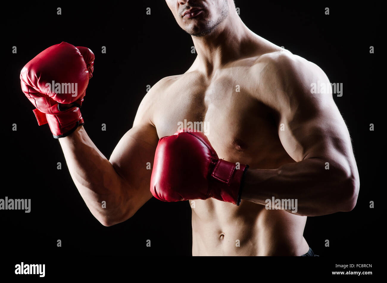 Muscular man in boxing concept Stock Photo - Alamy