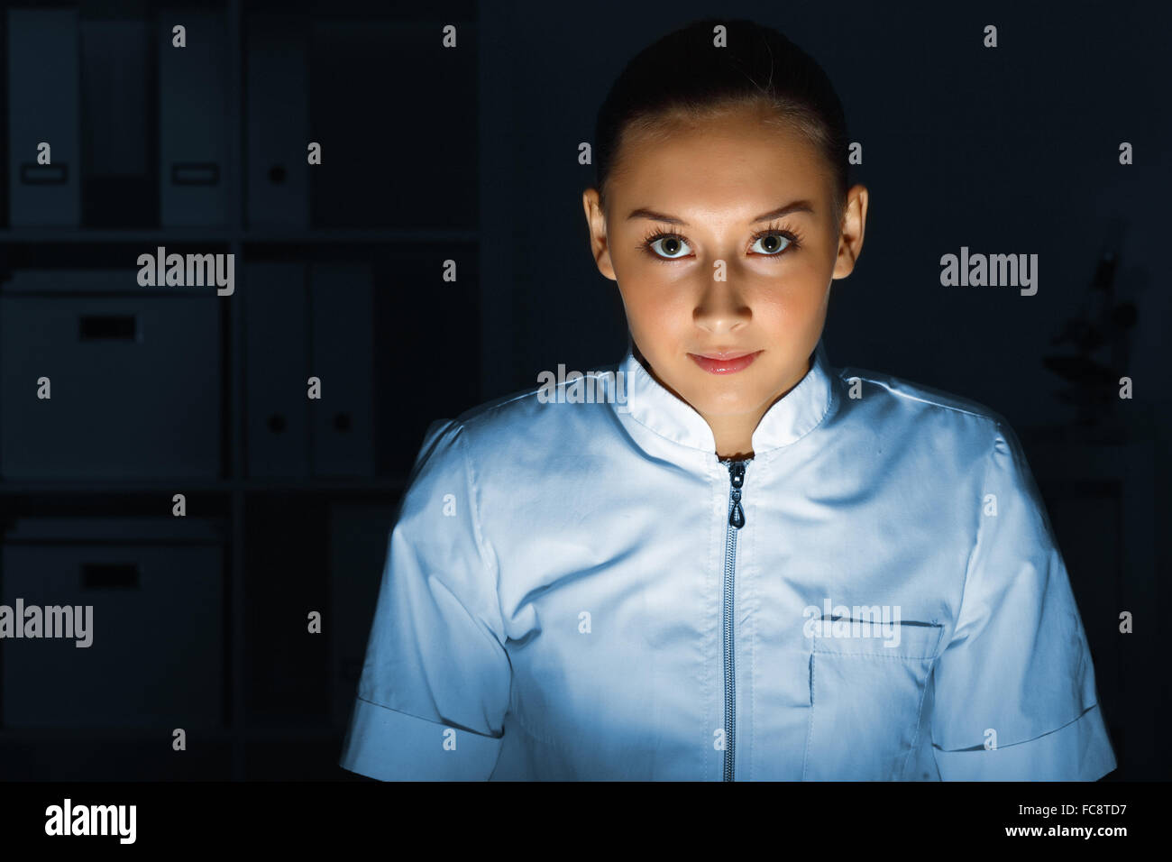Young chemist in white uniform working in laboratory Stock Photo - Alamy