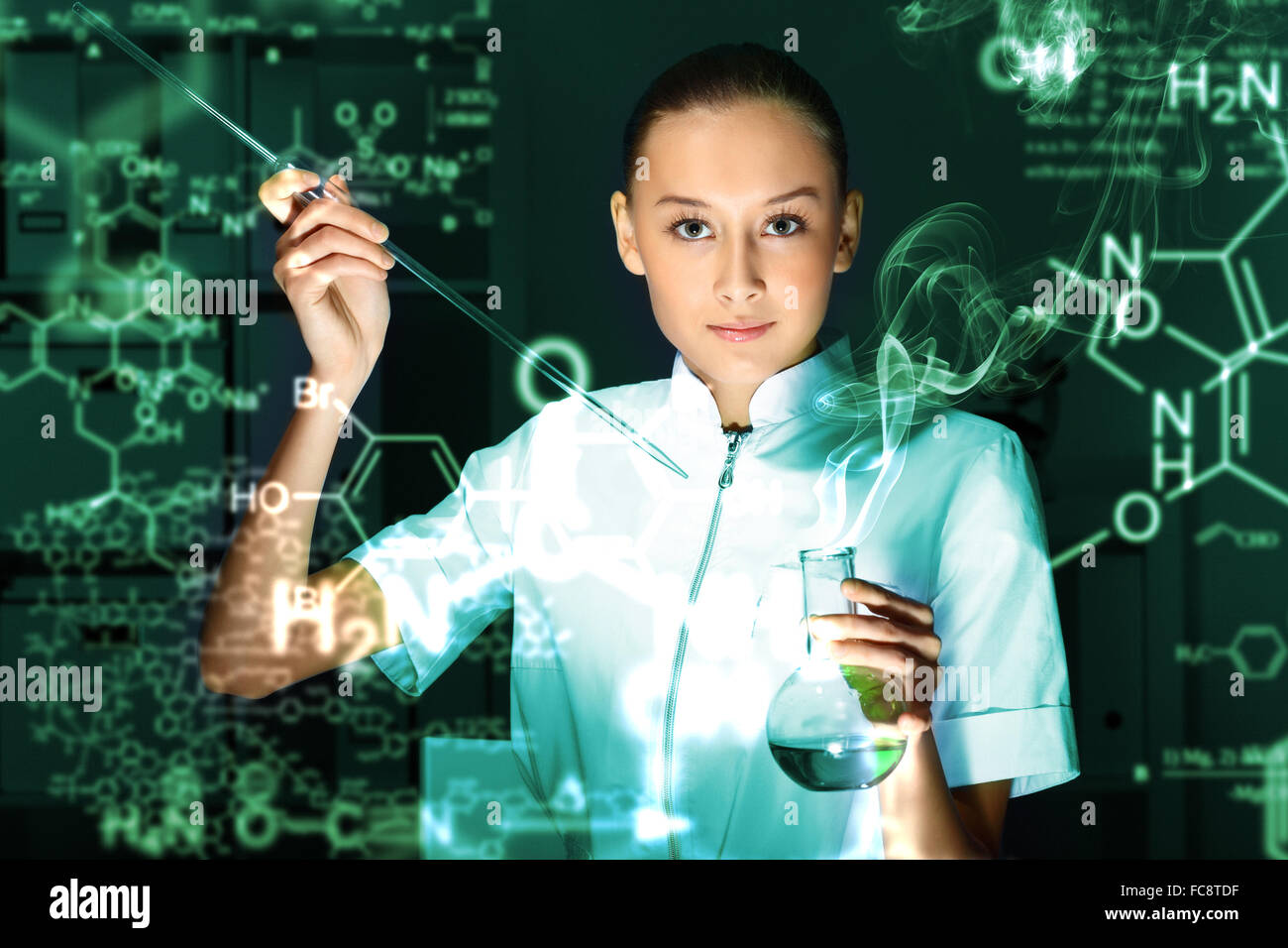 Young chemist in white uniform working in laboratory Stock Photo - Alamy