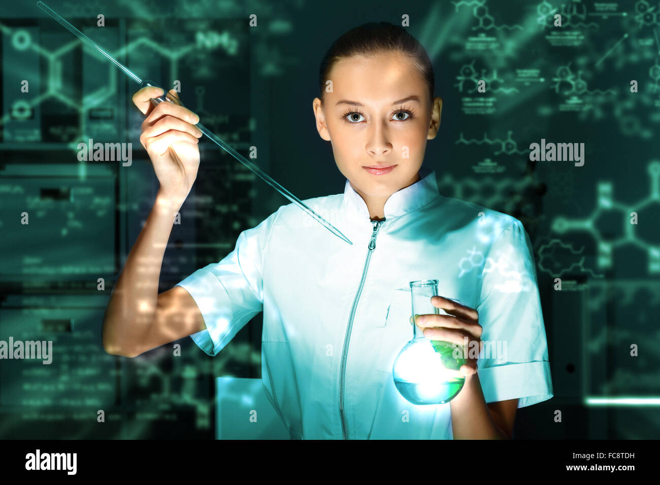 Young chemist in white uniform working in laboratory Stock Photo - Alamy