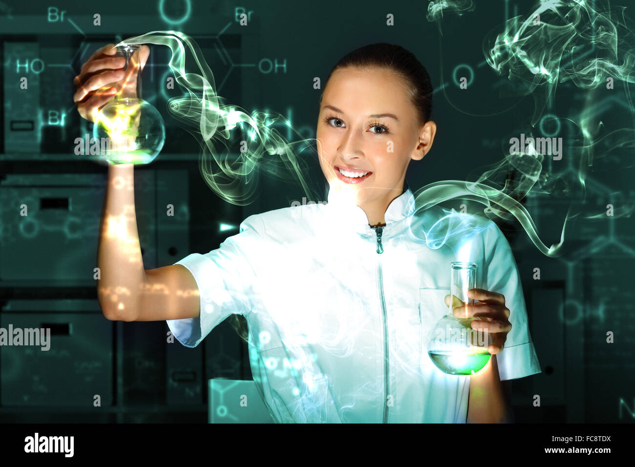 Young chemist in white uniform working in laboratory Stock Photo - Alamy