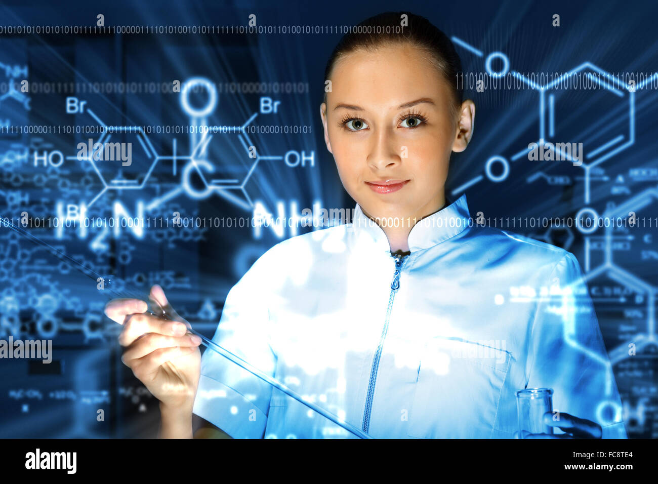 Young chemist in white uniform working in laboratory Stock Photo - Alamy