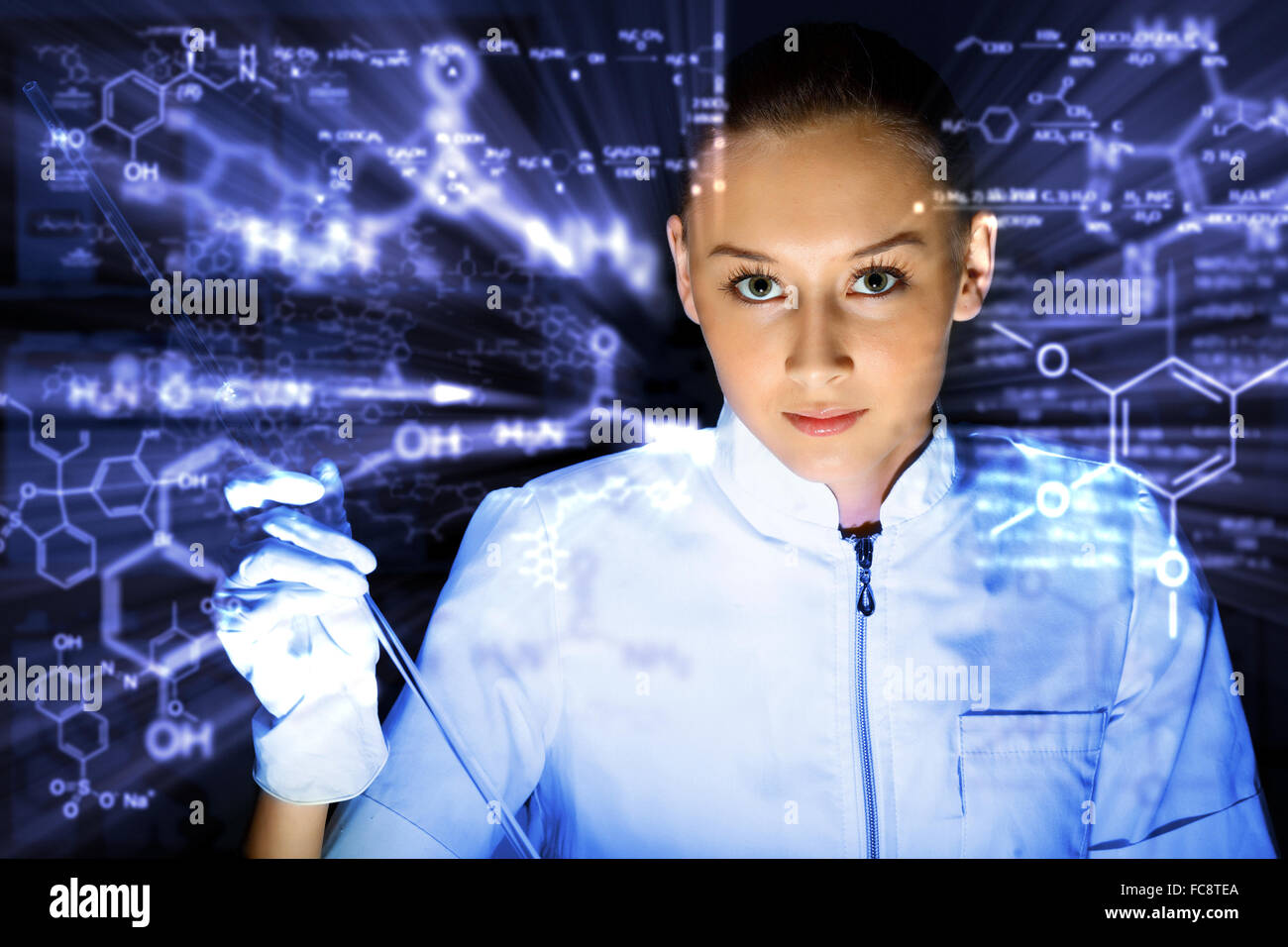 Young chemist in white uniform working in laboratory Stock Photo - Alamy
