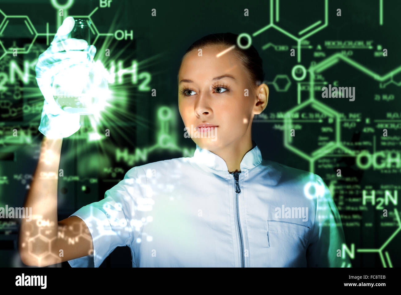 Young chemist in white uniform working in laboratory Stock Photo - Alamy