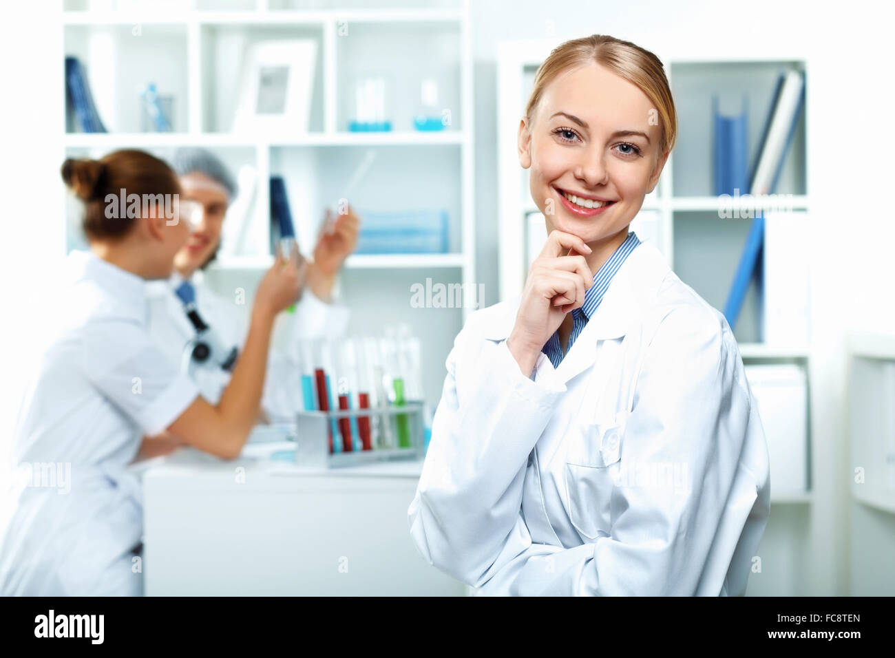 Young scientists in white uniform working in laboratory Stock Photo - Alamy