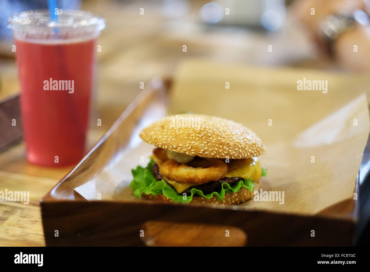 Cheeseburger on sesame buns Stock Photo - Alamy